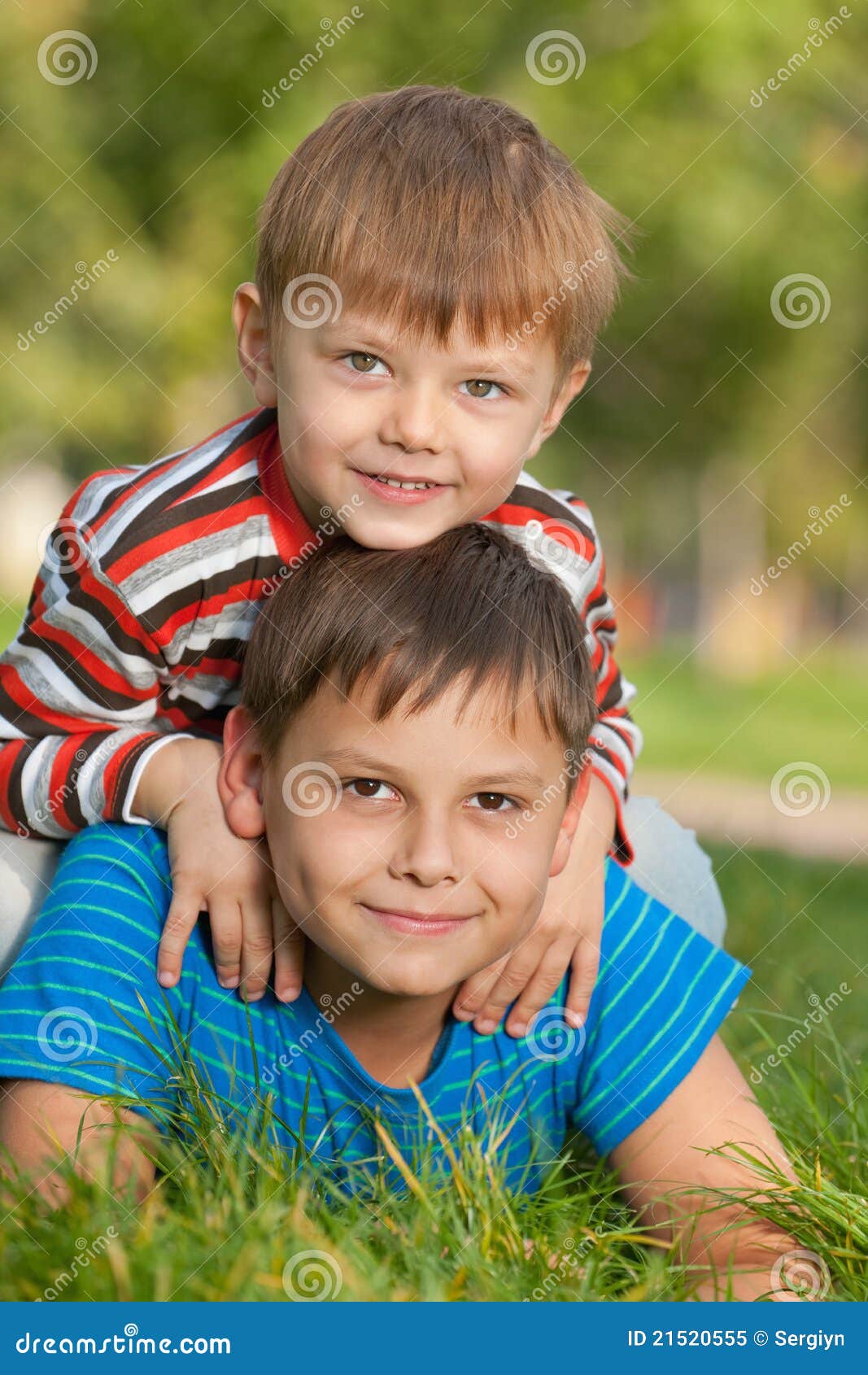 Two Smiling Brothers on the Grass Stock Image - Image of closeup ...