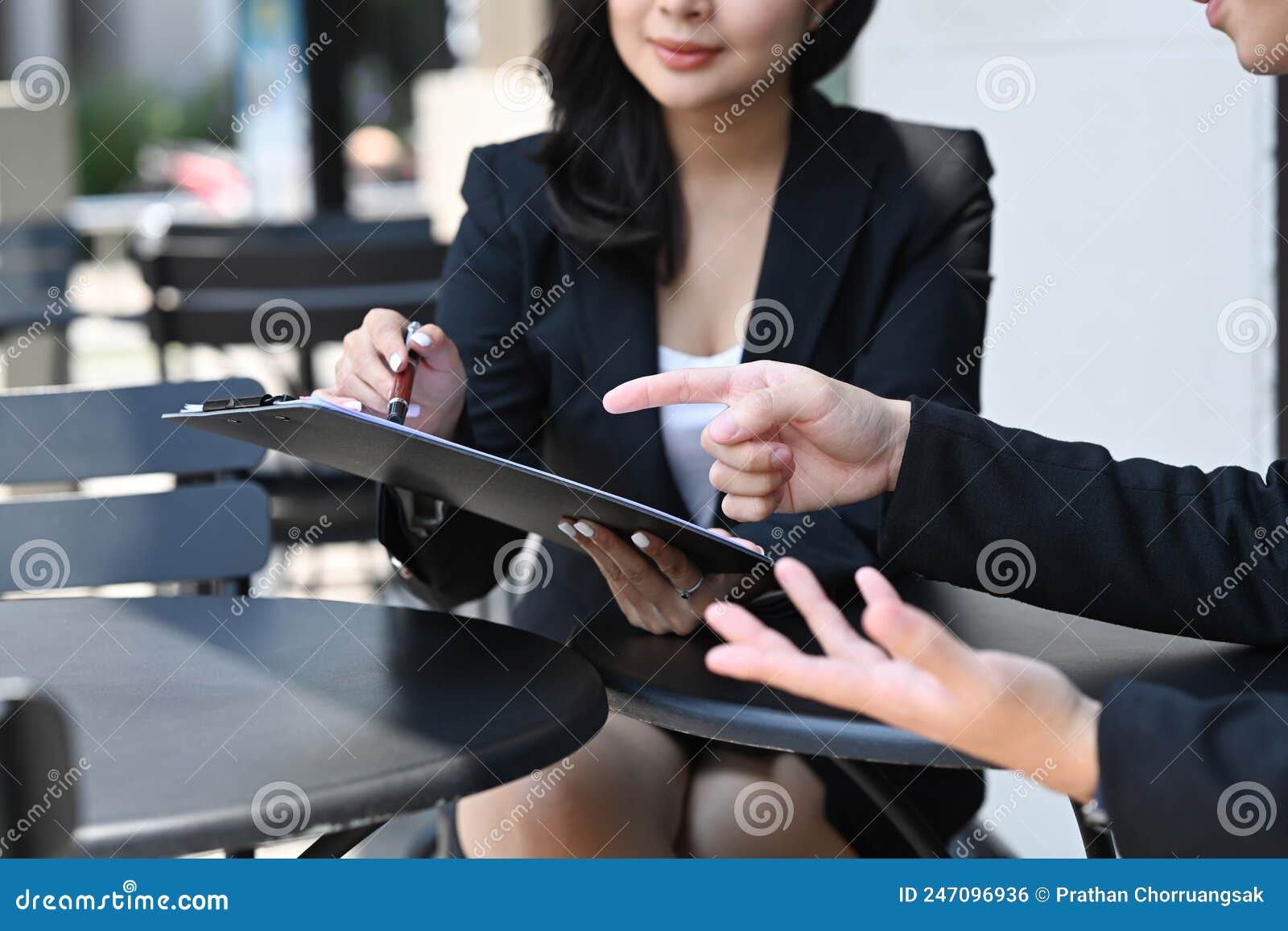 Two Business Colleagues Reading Documents, Working Together on Project ...