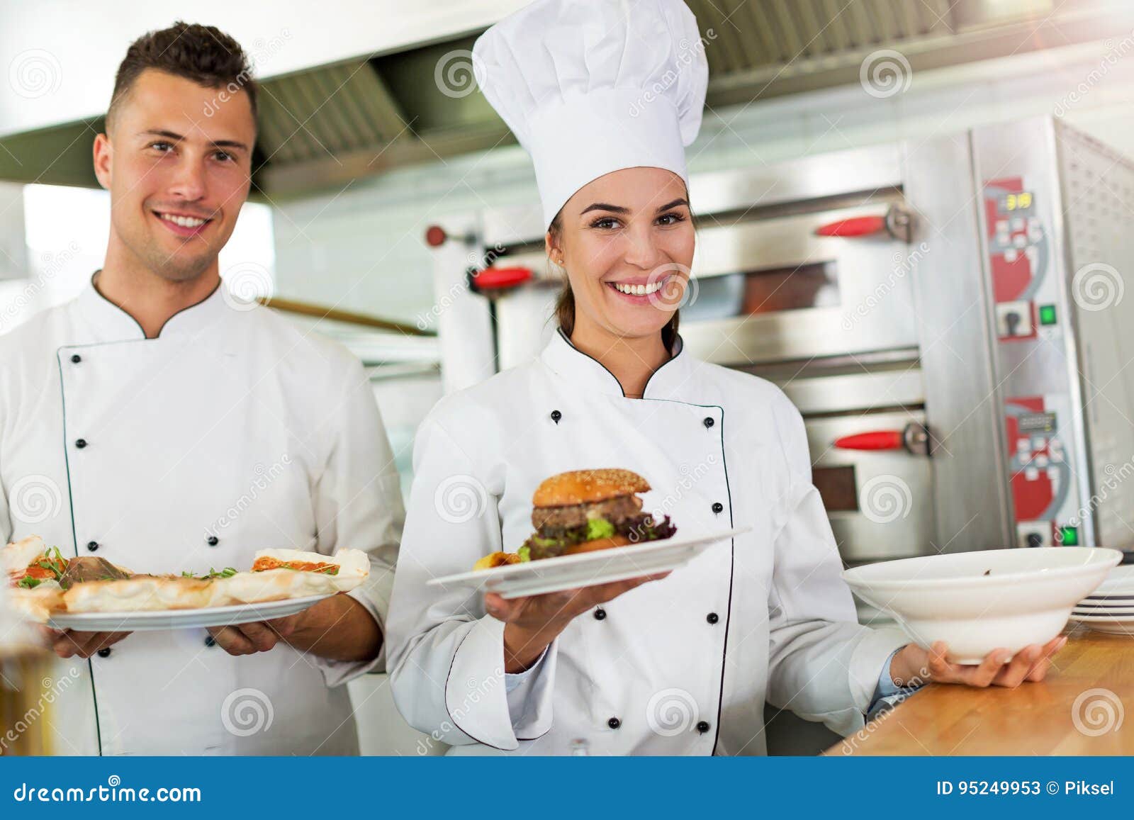 Two Smiling Chefs in Kitchen Stock Image - Image of couple, people ...