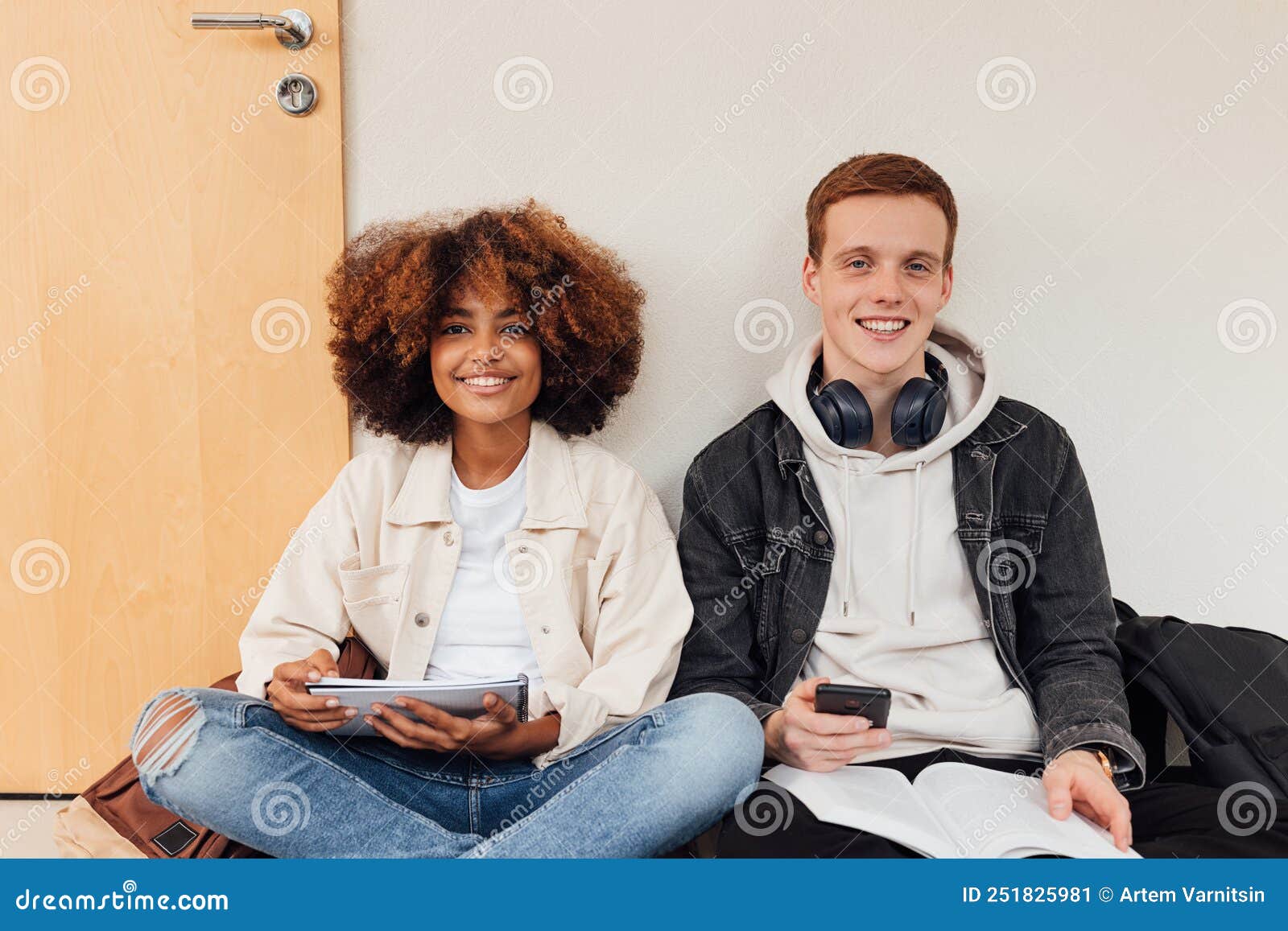 Two Smiling Classmates Looking at Camera. Cheerful Students Sitting ...