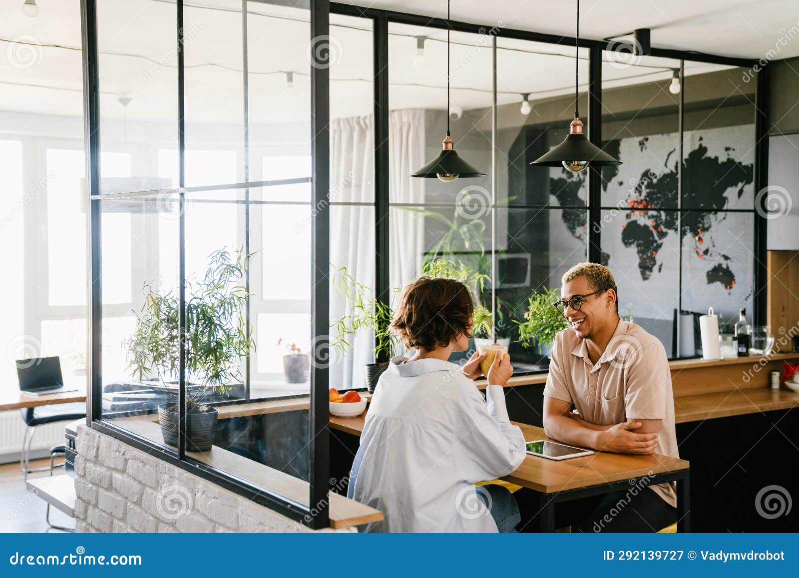 Two Smiling Colleagues Talking during Coffee Break in Office Kitchen ...