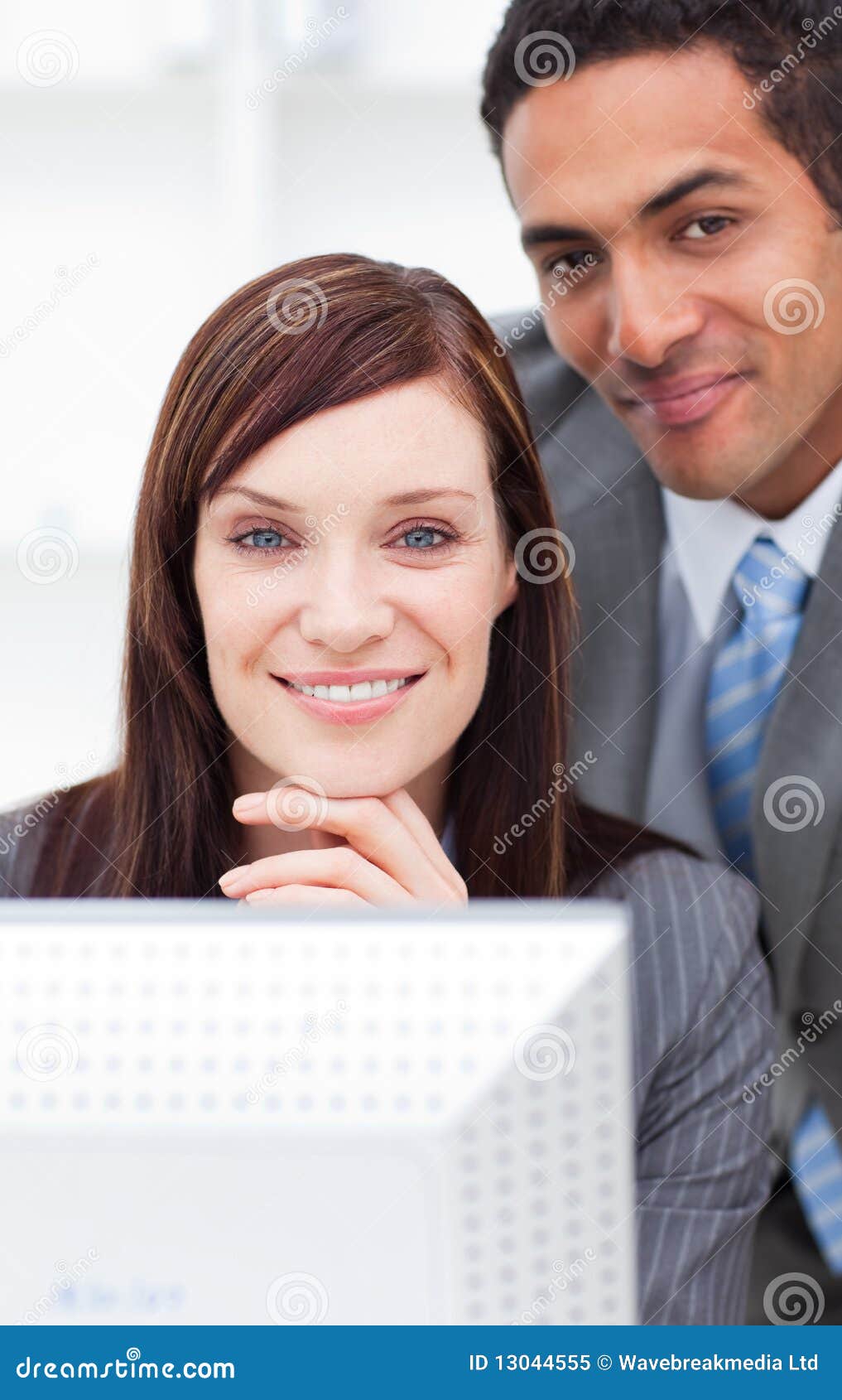 Two Smiling Colleagues Working at a Computer Stock Image - Image of ...