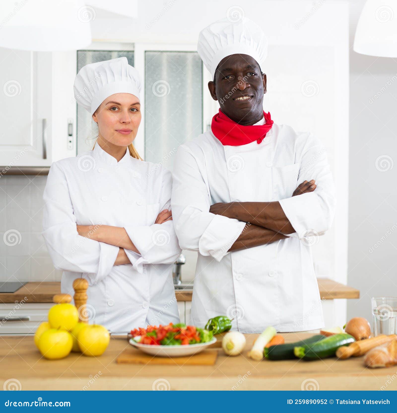 Two Smiling Confident Personal Chefs in White Uniforms Standing in ...