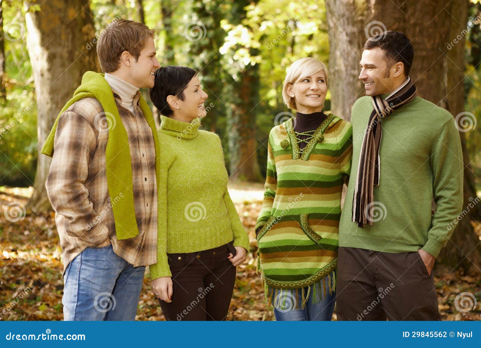 Two Couples Talking in Autumn Forest Stock Photo - Image of hike, chat ...