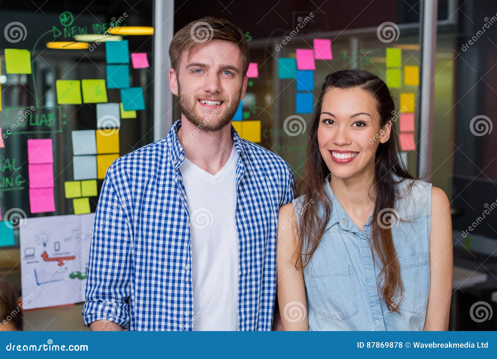 Two Smiling Executives Standing Together in Office Stock Photo - Image ...