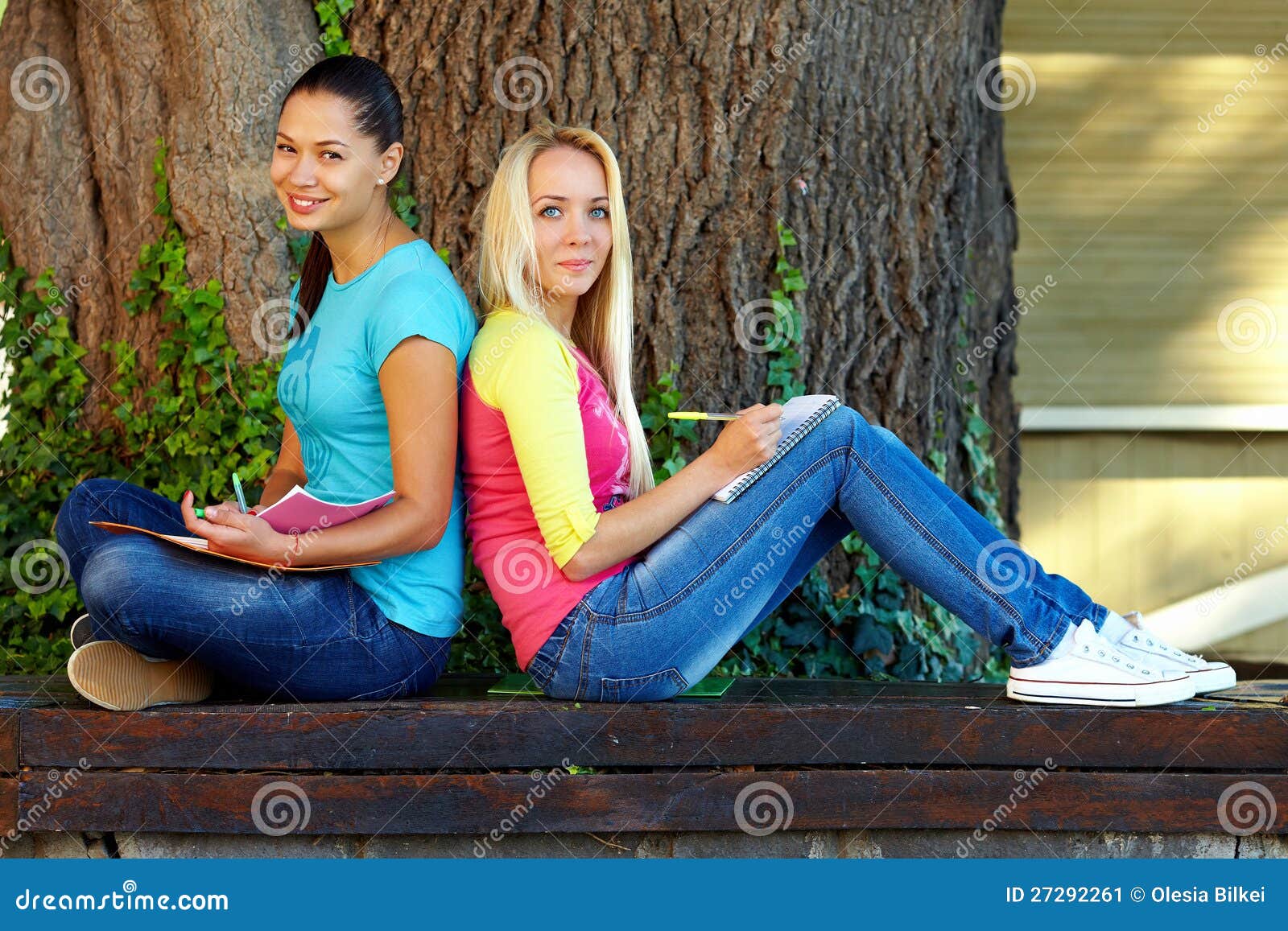 Two Smiling Female Student Sit on Bench Stock Image - Image of ...