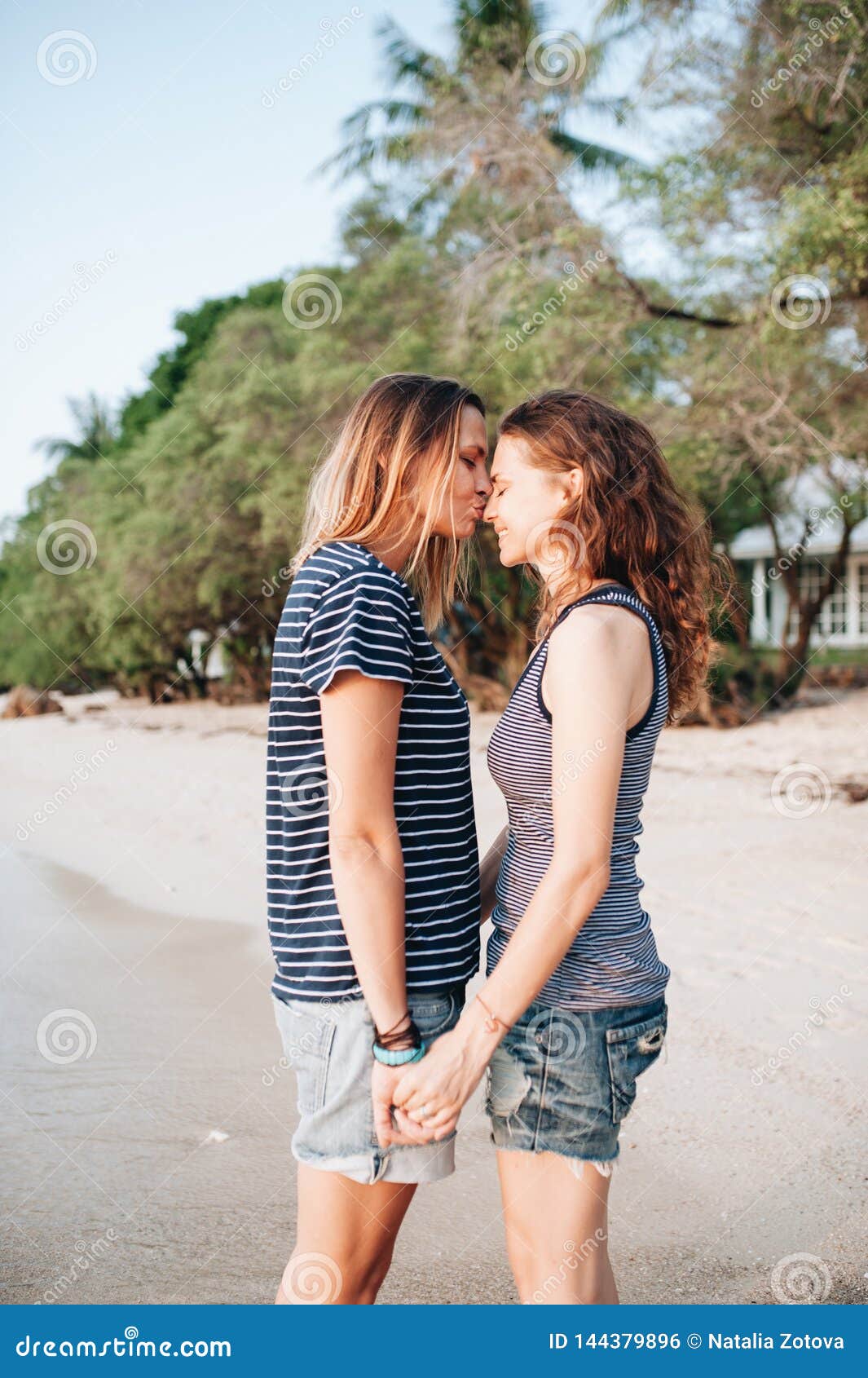 Two Smiling Friends Hugging Each Other on the Beach Stock Photo - Image ... Two Smiling Friends Hugging Each Other on the Beach Stock Photo - Image ...