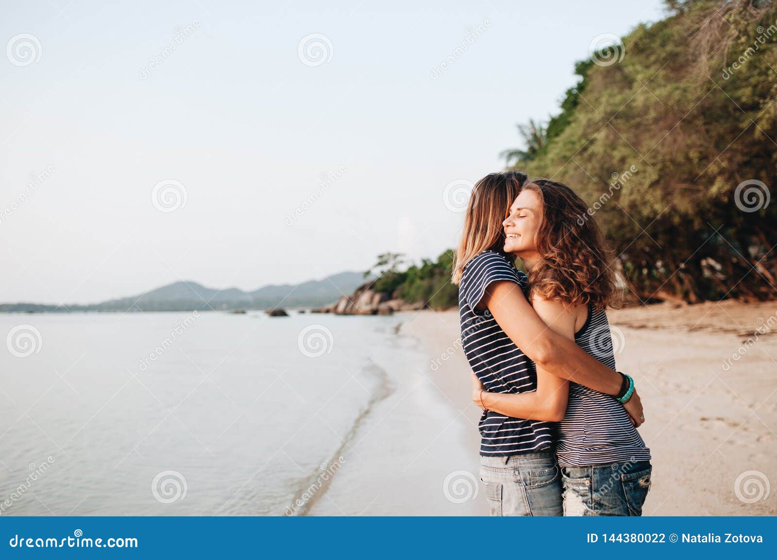 Two Smiling Friends Hugging Each Other on the Beach Stock Photo - Image ... Two Smiling Friends Hugging Each Other on the Beach Stock Photo - Image ...