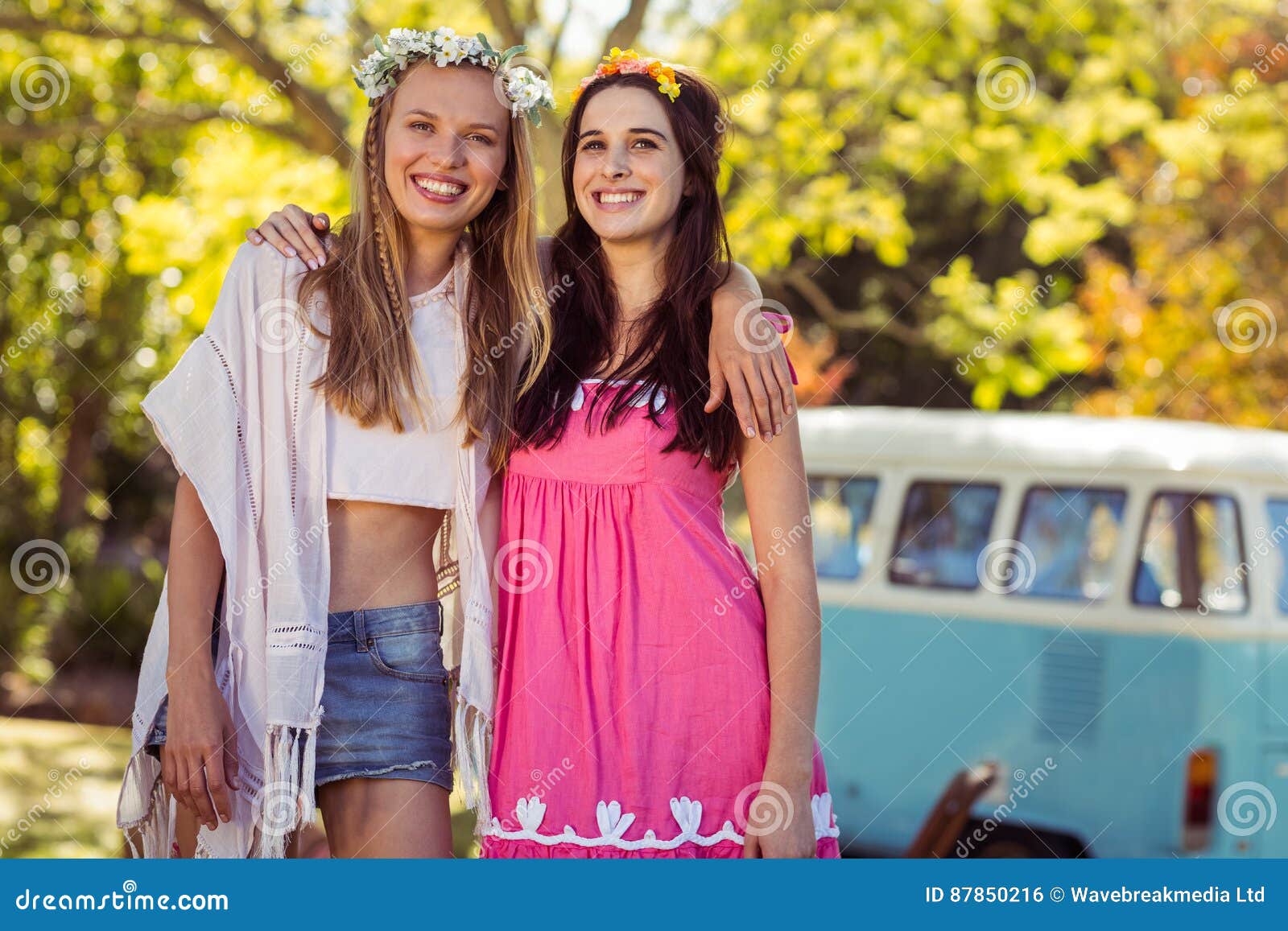 Two Smiling Friends Standing Together Stock Photo - Image of lawn ...