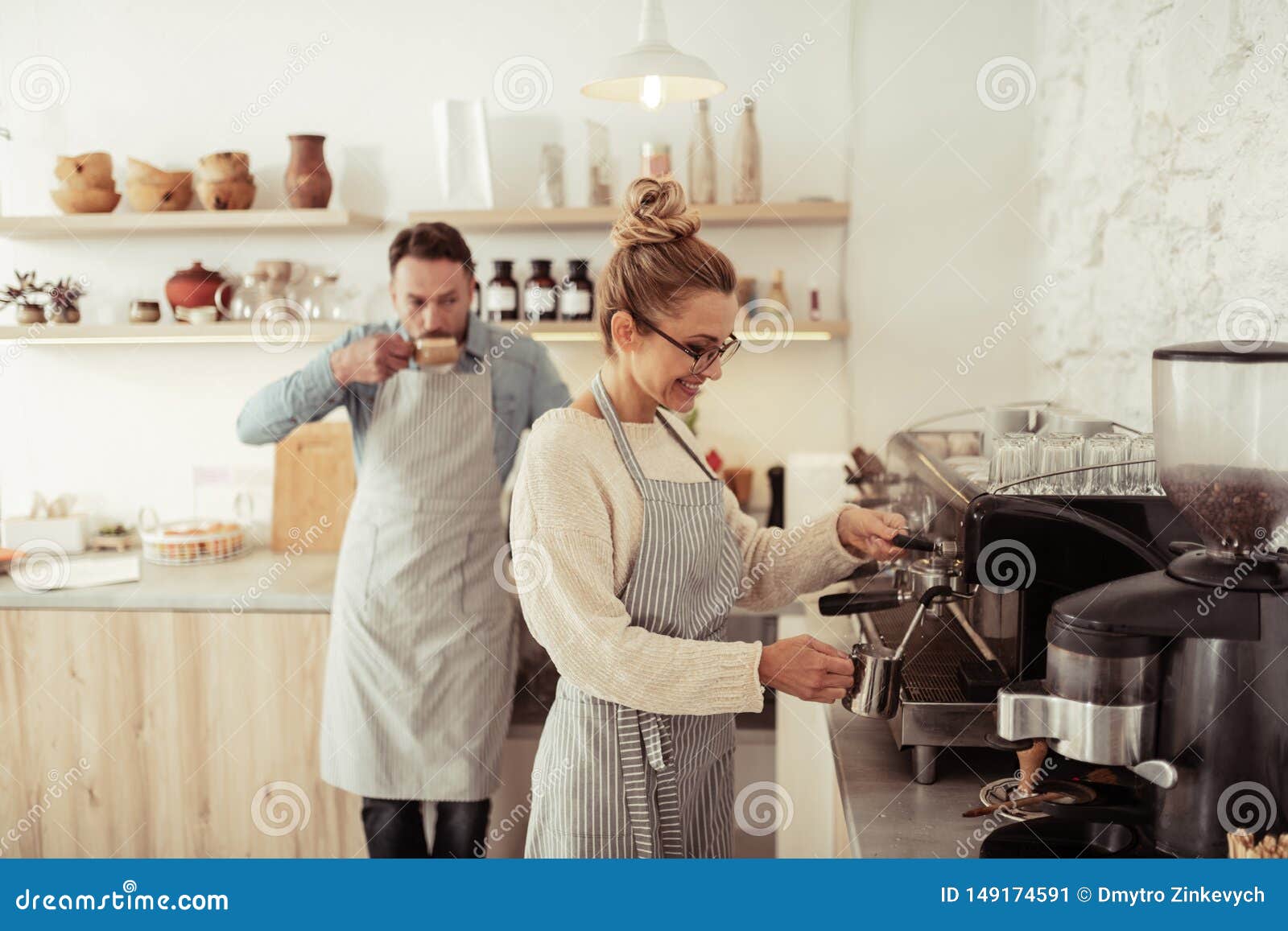 Two Smiling People by the Coffee Machine. Stock Image - Image of ...