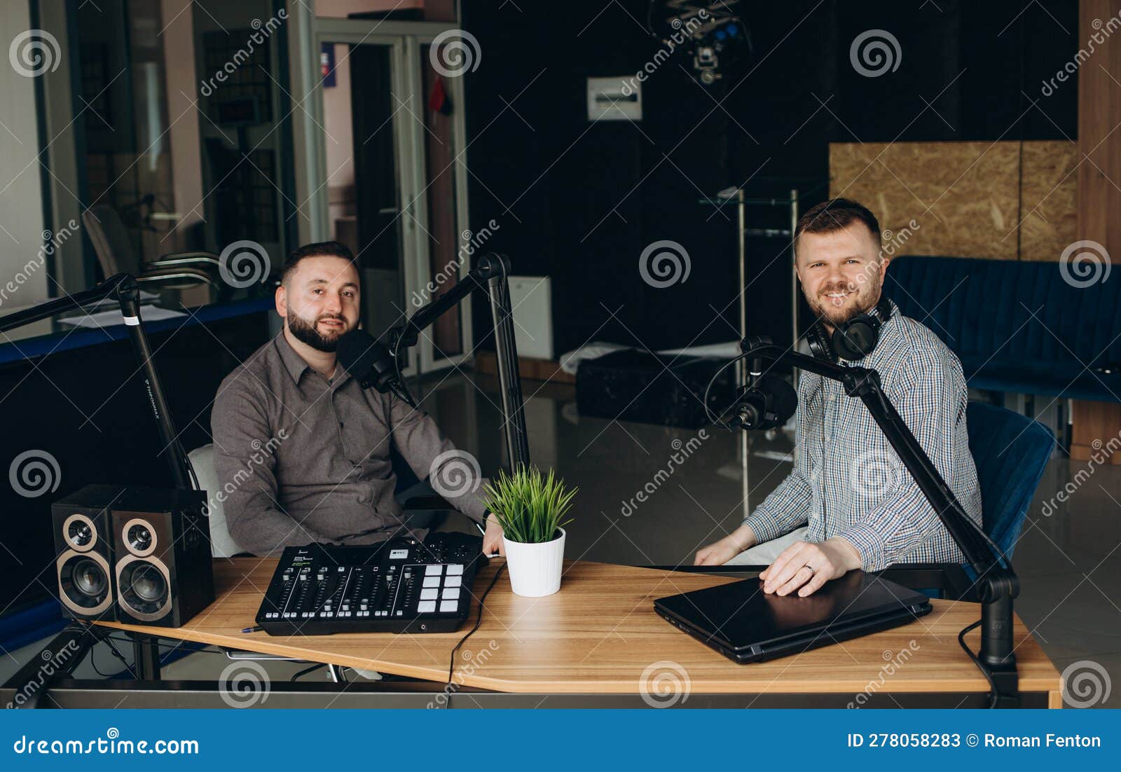 Two Smiling Radio Hosts Talking while Recording Podcast in Broadcasting ...