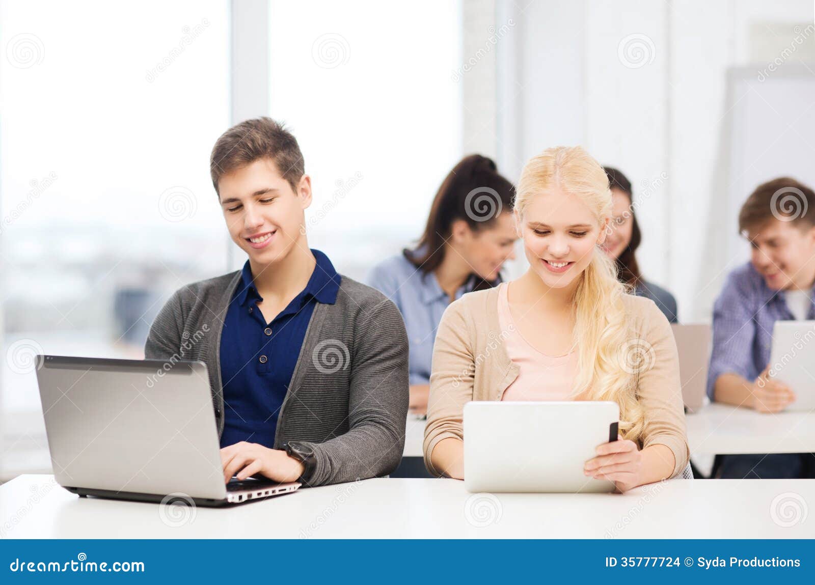 Two Smiling Students with Laptop and Tablet Pc Stock Photo - Image of ...