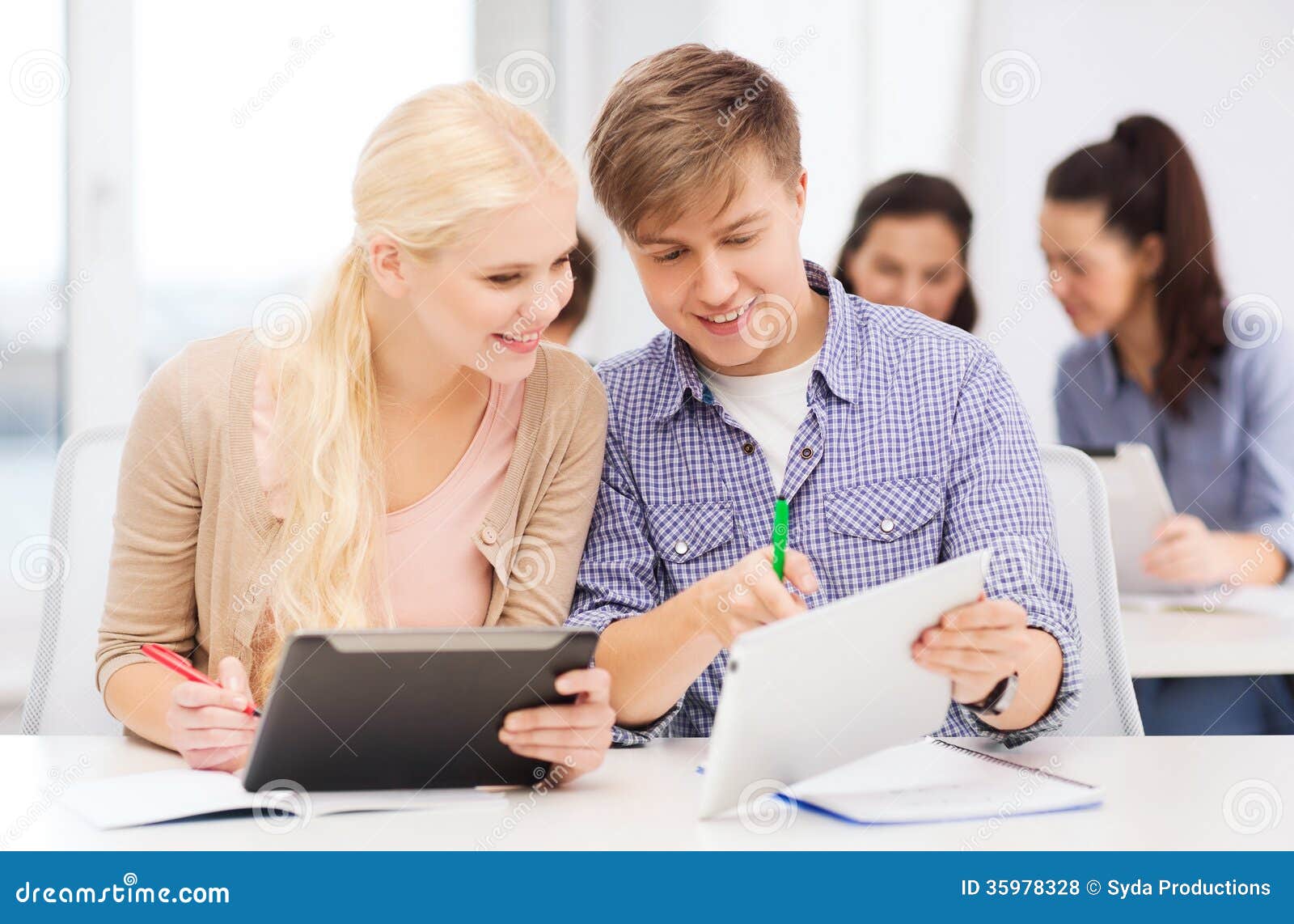 Two Smiling Students with Tablet Pc and Notebooks Stock Photo - Image ...