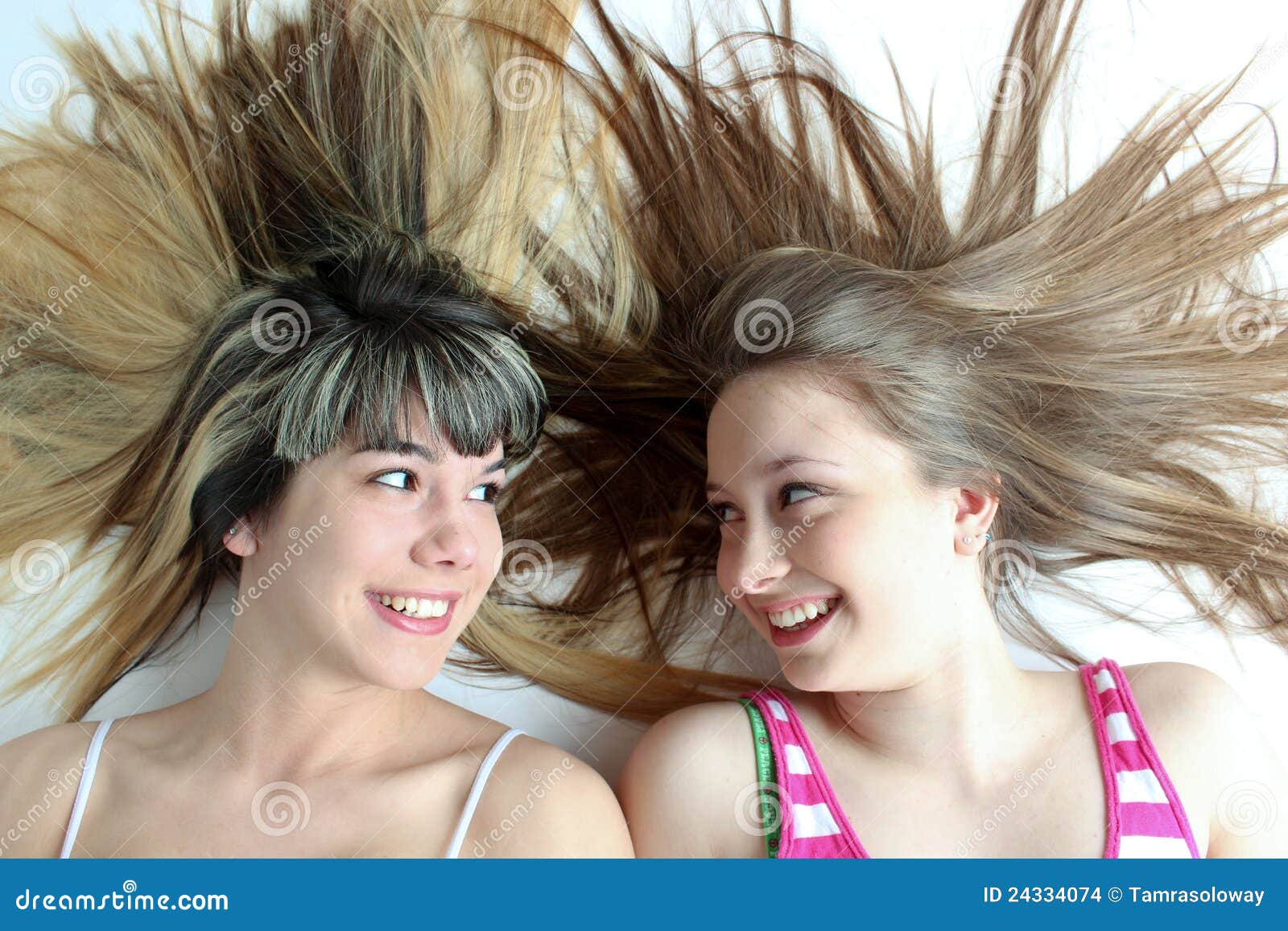 Two smiling teens stock photo. Image of enjoying, together - 24334074