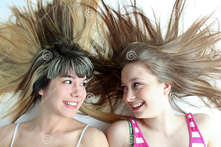 Two smiling teens stock photo. Image of enjoying, together - 24334074