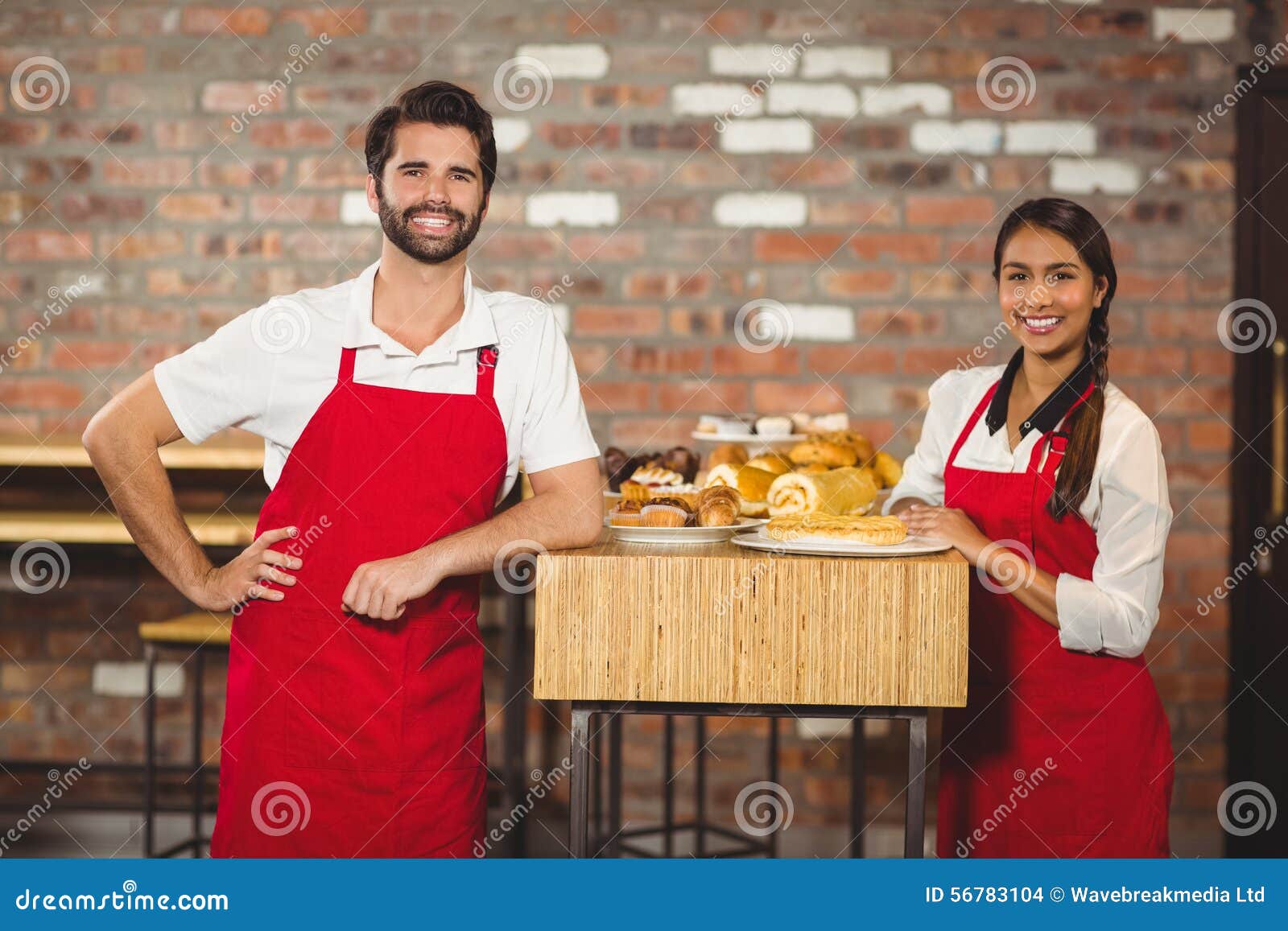 Two Smiling Waiters Looking at the Camera Stock Photo - Image of food ...