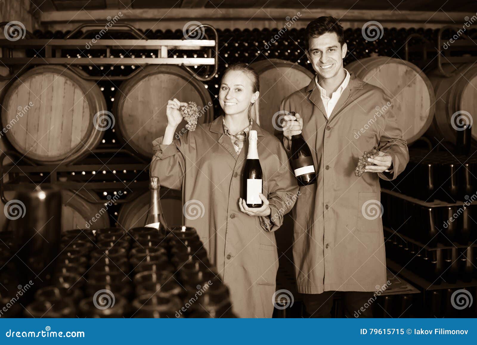 Two Smiling Winery Employees in Aging Section in Cellar Stock Image ...