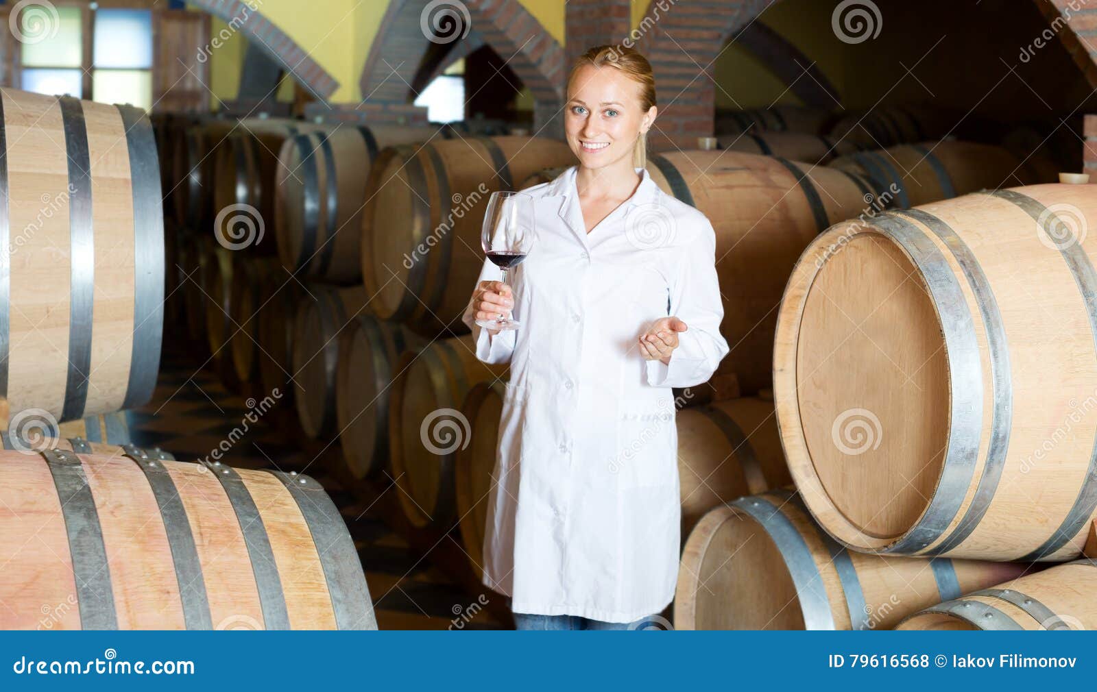 Two Smiling Winery Employees in Aging Section in Cellar Stock Photo ...