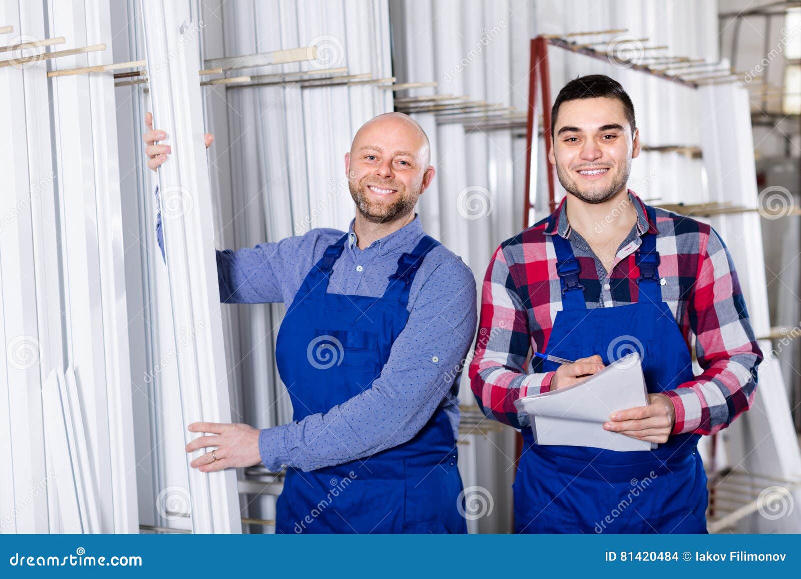 Two Smiling Workmen at Factory Stock Photo - Image of effective, indoor ...