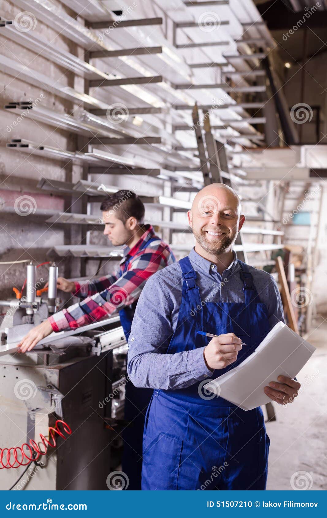 Two Smiling Workmen at Factory Stock Photo - Image of indoor, frames ...