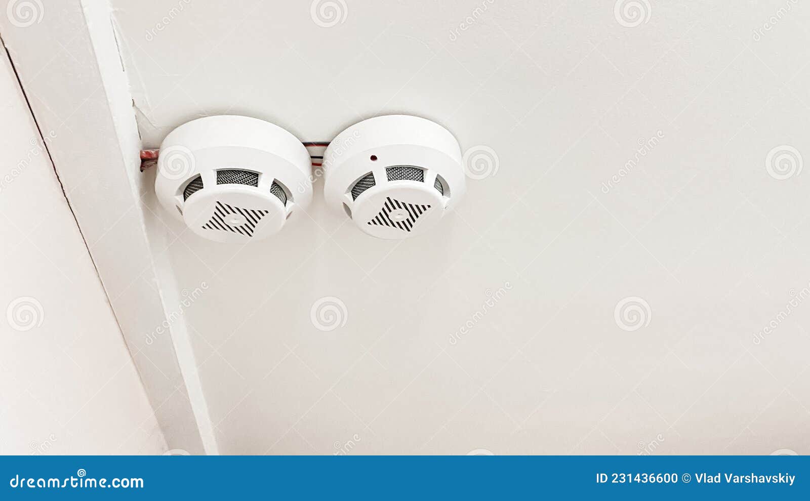 Two Smoke Detectors are Installed on the Ceiling in a Residential ...