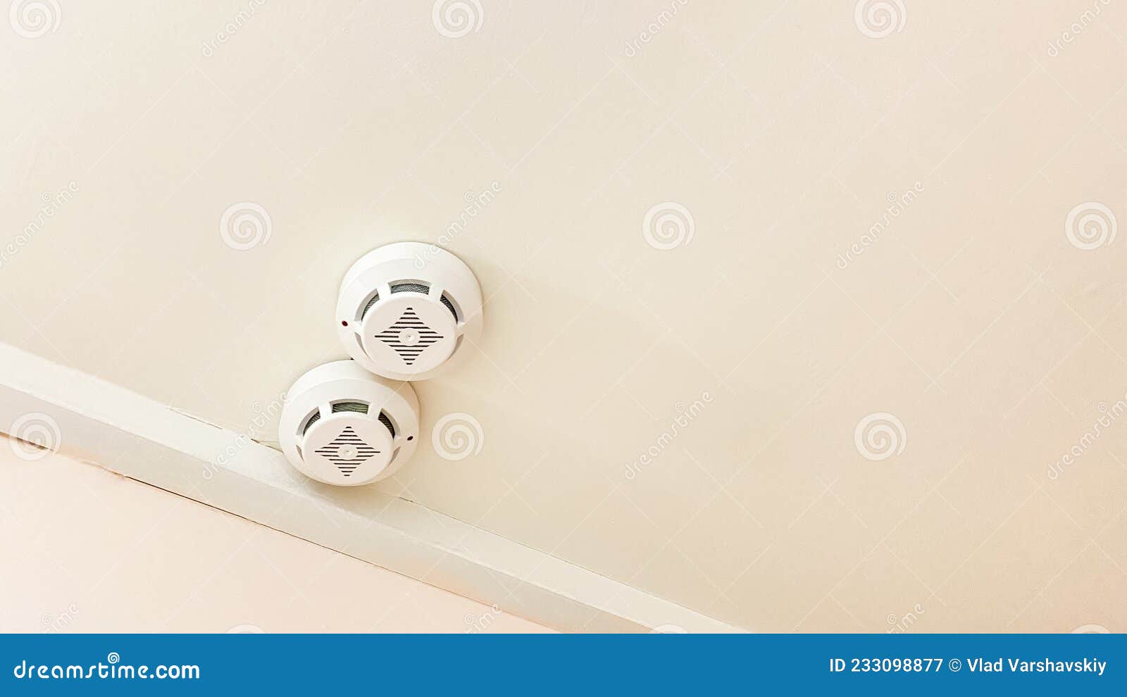 Two Smoke Detectors are Installed on the Ceiling in a Residential ...