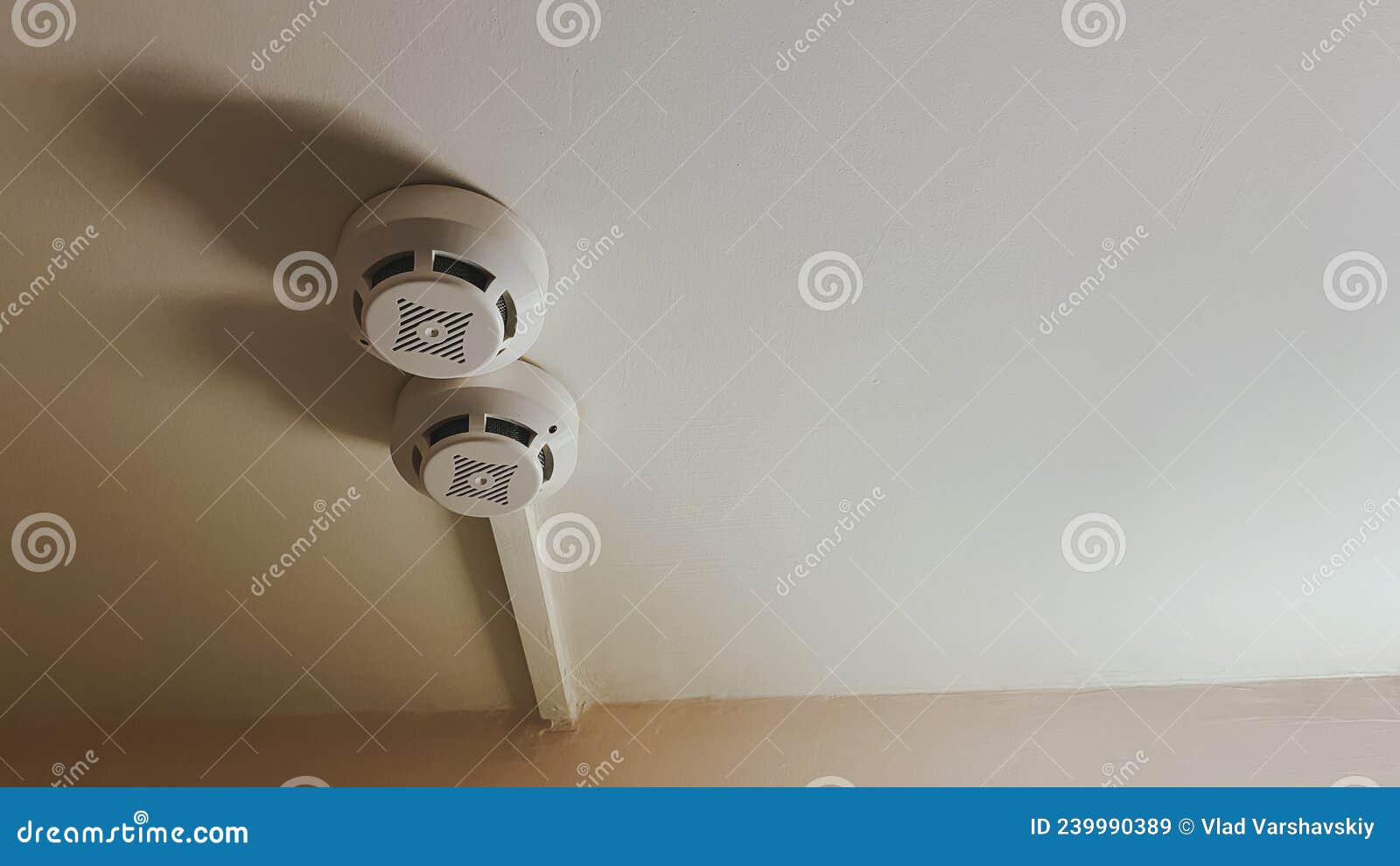 Two Smoke Detectors are Installed on the Ceiling in a Residential ...