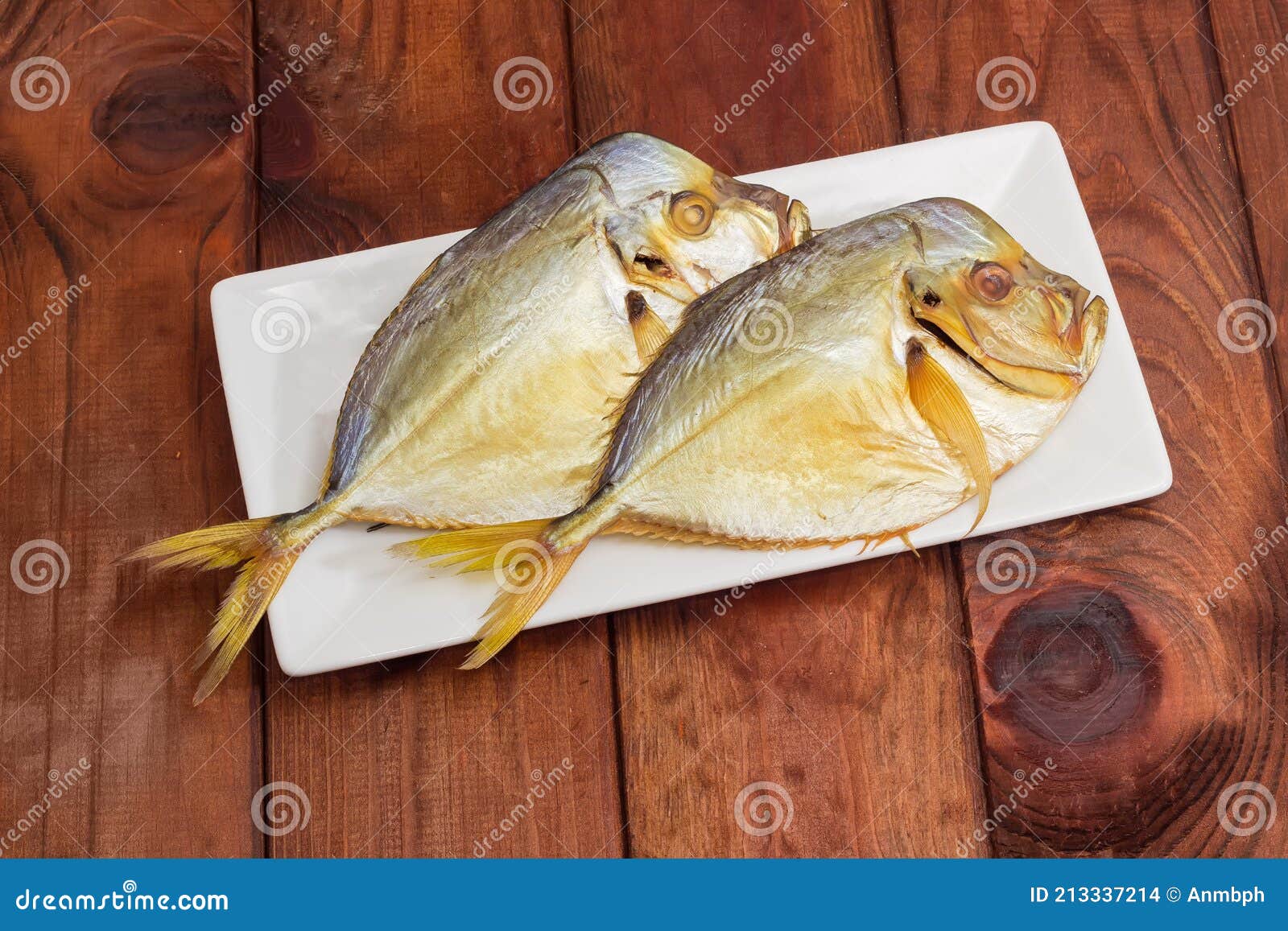 Two Smoked Atlantic Moonfish on Dish on Rustic Table Stock Photo ...