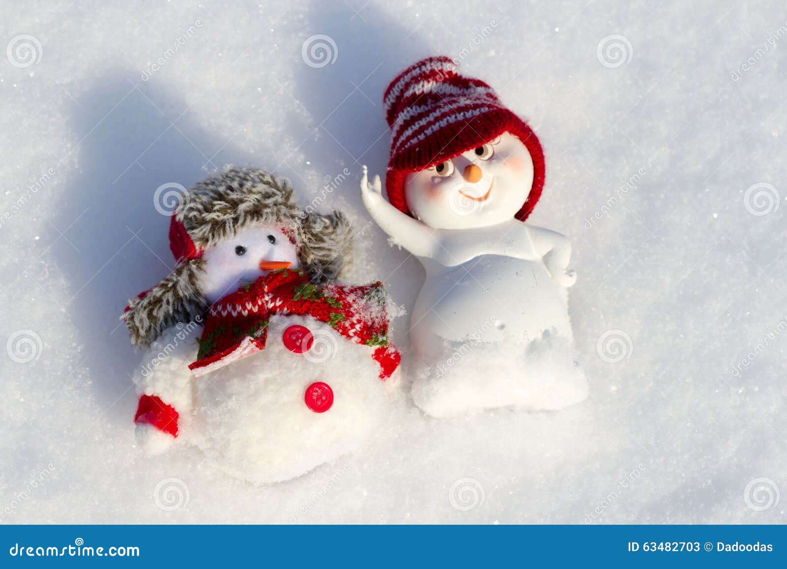 Two Snowman Lying on the Snow Stock Image - Image of outdoors, girl ...