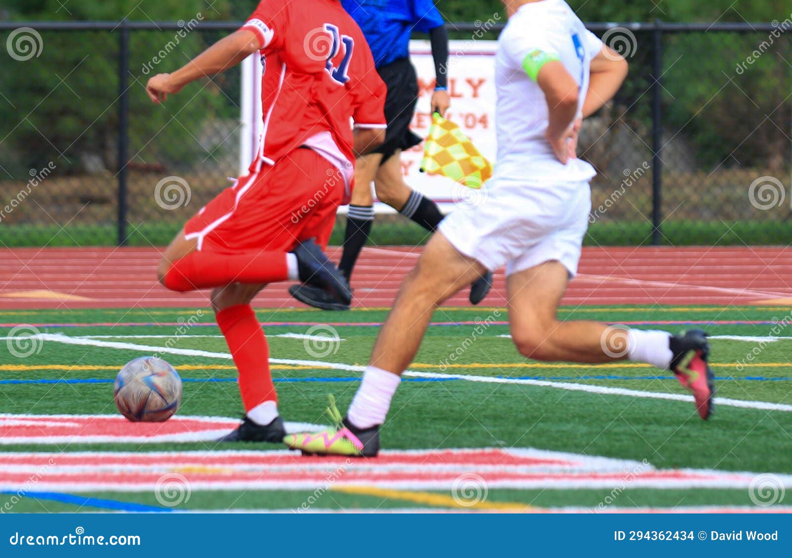 Two Soccer Players Chasing the Ball during a Game Stock Photo - Image ...