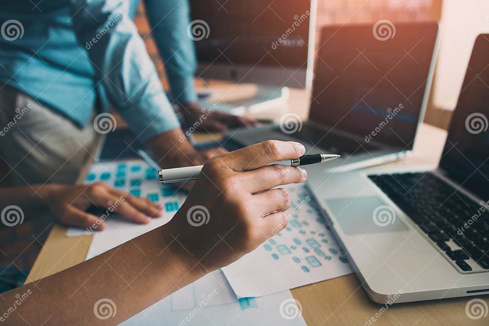 Two Software Developers are Analyzing Together about the Code Written ...