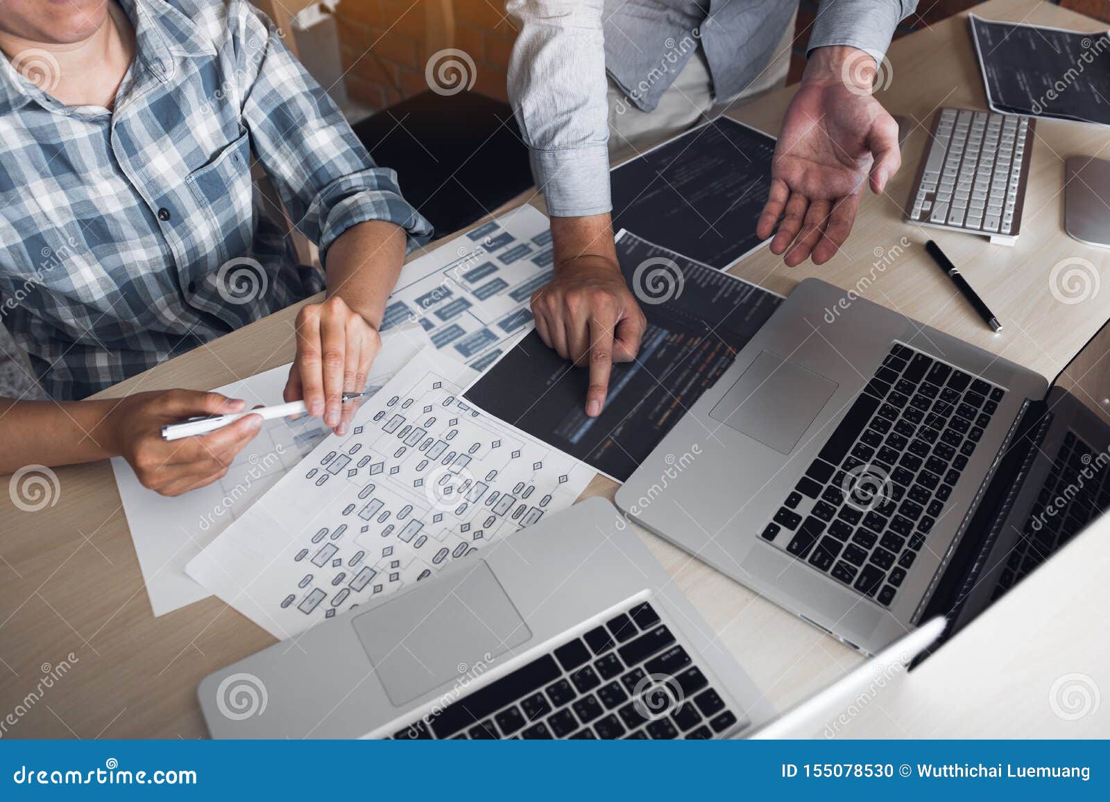 Two Software Developers Are Analyzing Together About The Code Written Into The Program On The