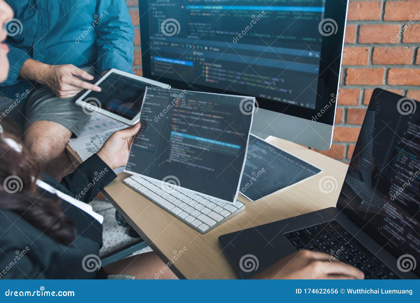 Two Software Developers Are Analyzing Together About The Code Written Into The Program On The