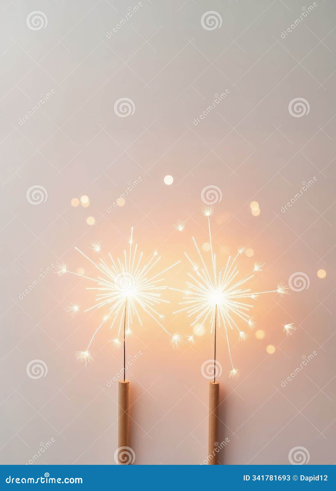 Two Sparklers are Sparkling with Wooden Sticks on a White Background ...