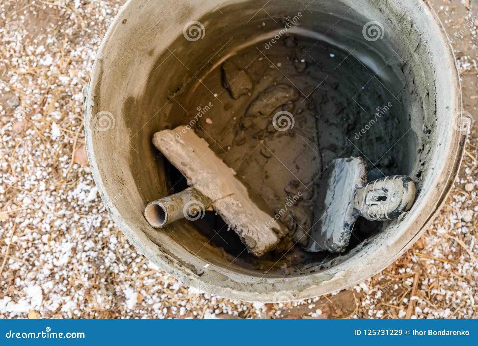 Two Spatulas in Bucket with the Mortar Stock Image - Image of house ...