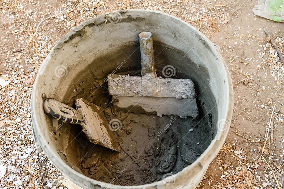 Two Spatulas in Bucket with the Mortar Stock Image - Image of ...