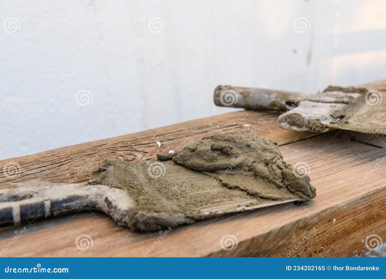 Two Spatulas with Mortar on a Old Wooden Board Stock Image - Image of ...