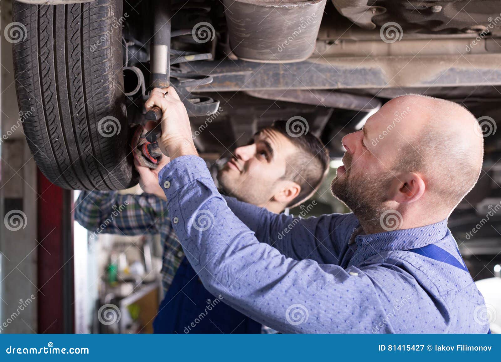 Two specialist fixing car stock image. Image of machine - 81415427