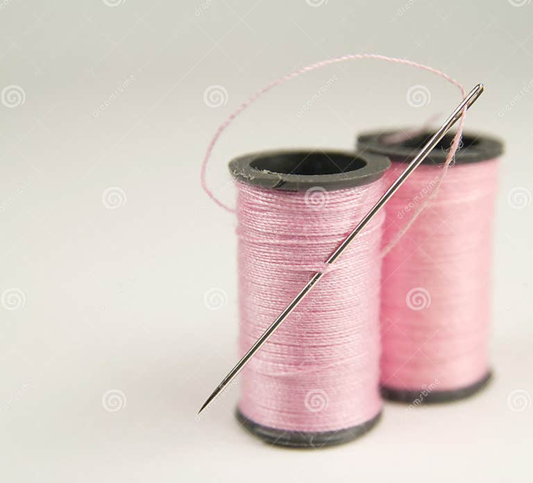 Two Spools of Pink Thread with Needle Stock Photo - Image of point ...