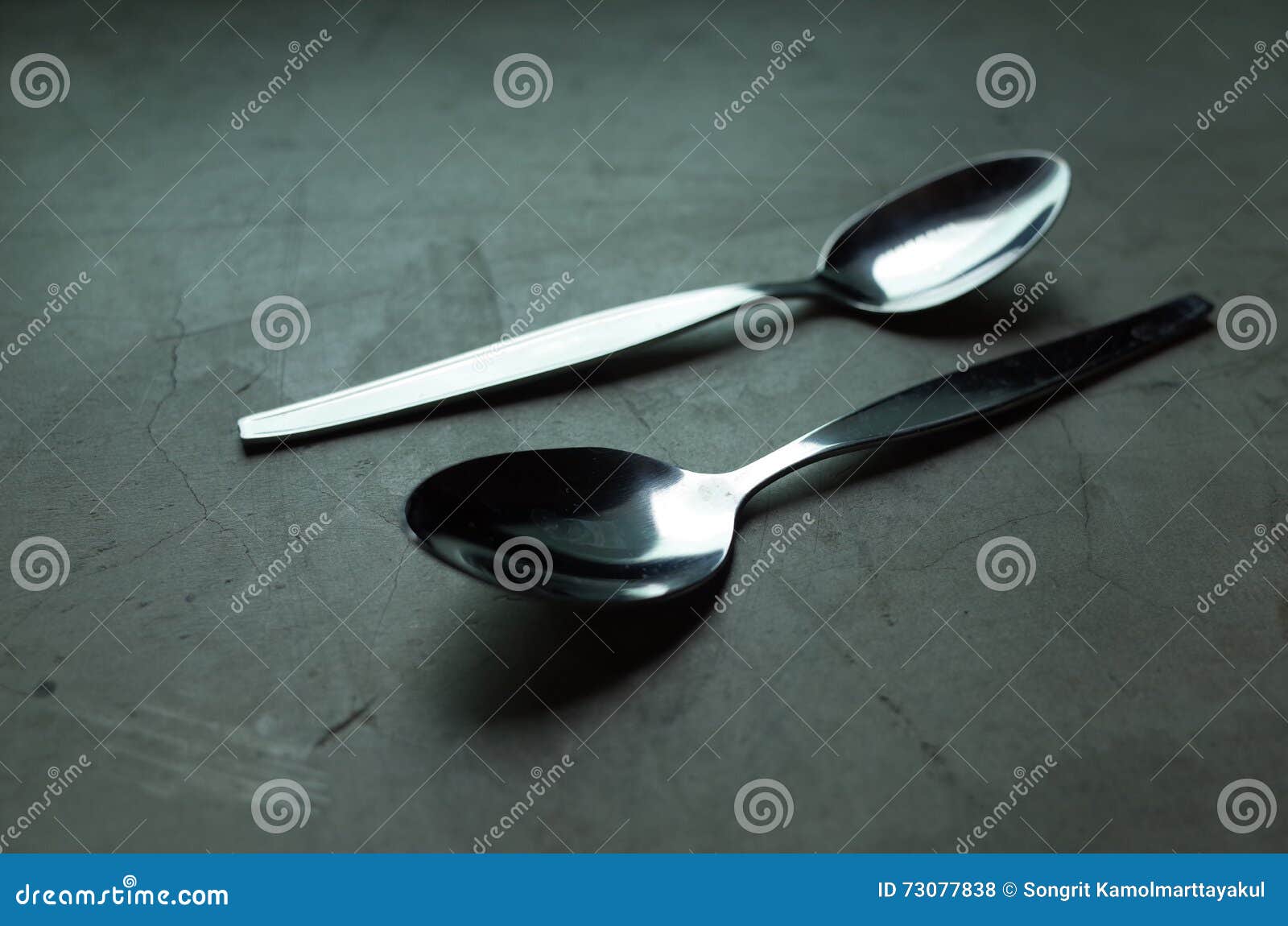 Two spoon. stock photo. Image of metal, spoon, concrete - 73077838