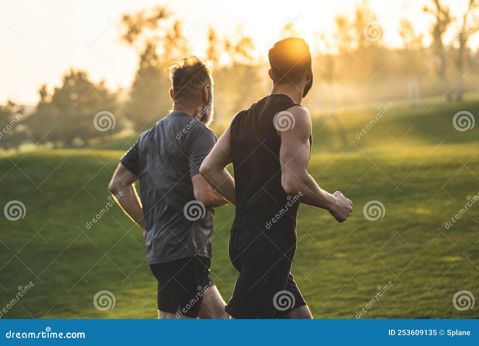 The Two Sportsmen Running on the Grass. Stock Image - Image of park ...
