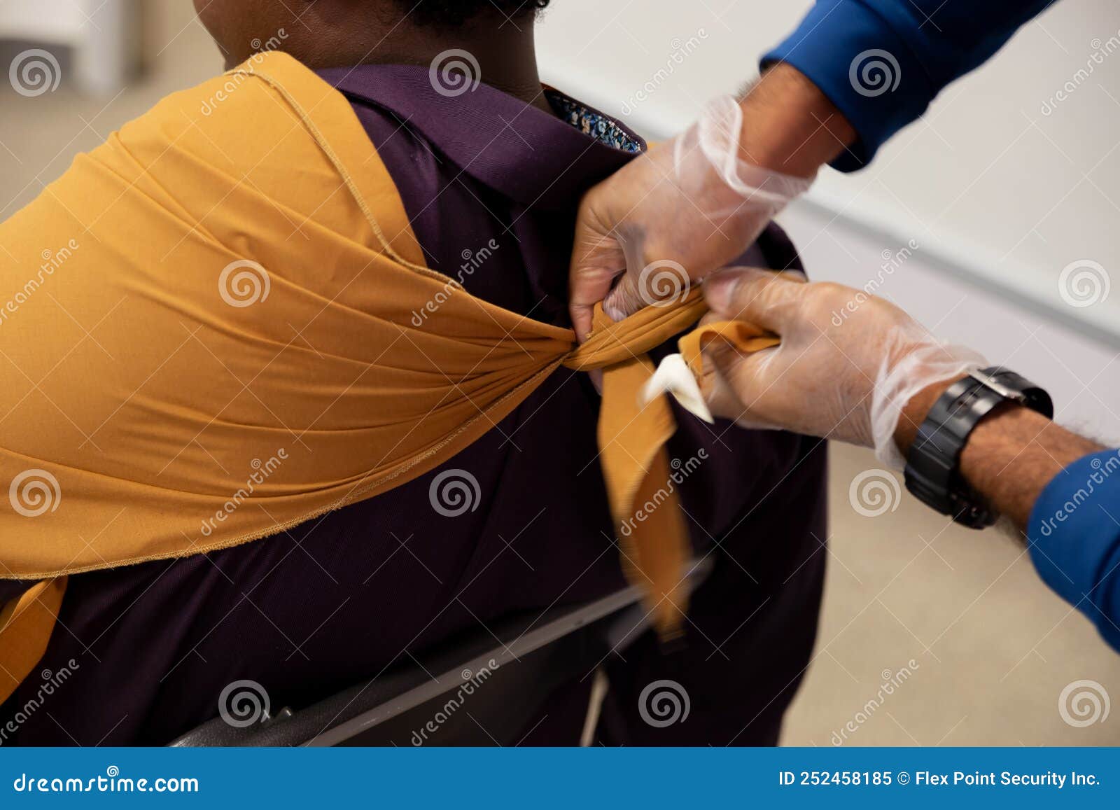 Two Staff Training To Give First Aid To Arm with Broken Bones Stock ...