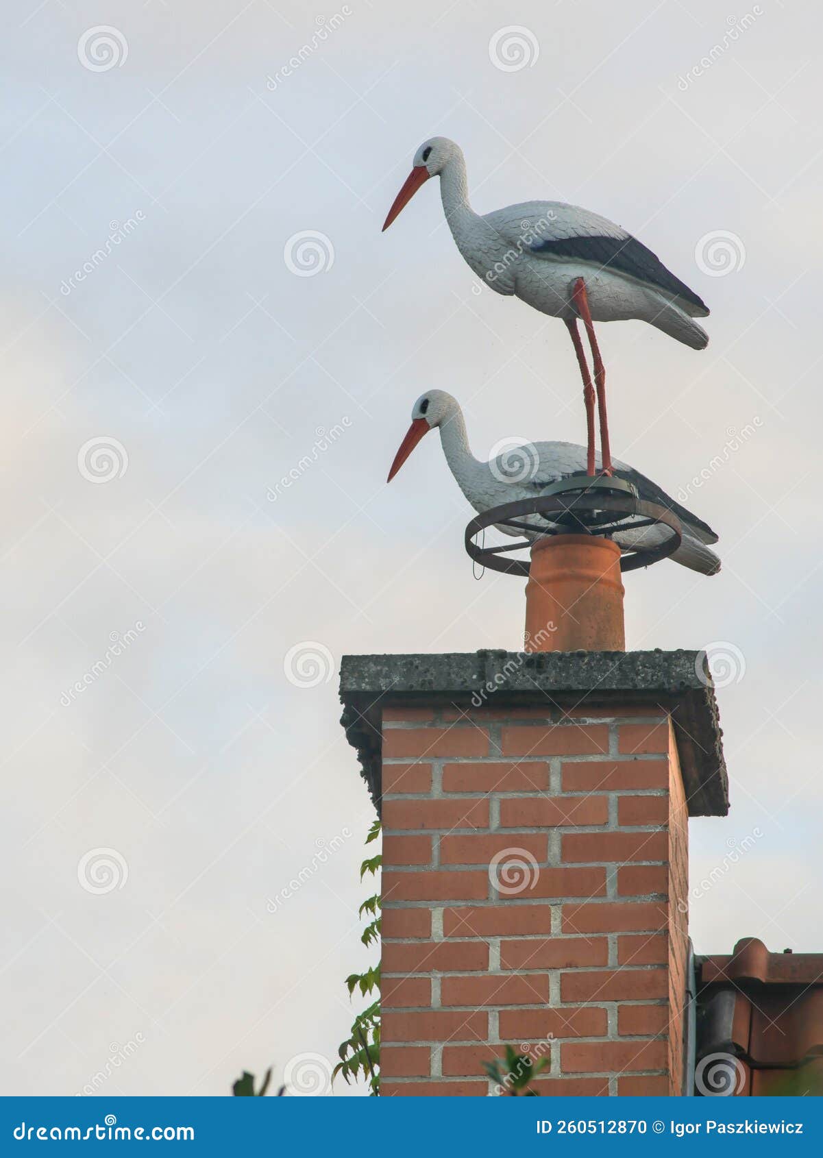 Two Statues of Storks on Top of a Chimney. Stock Photo - Image of ...