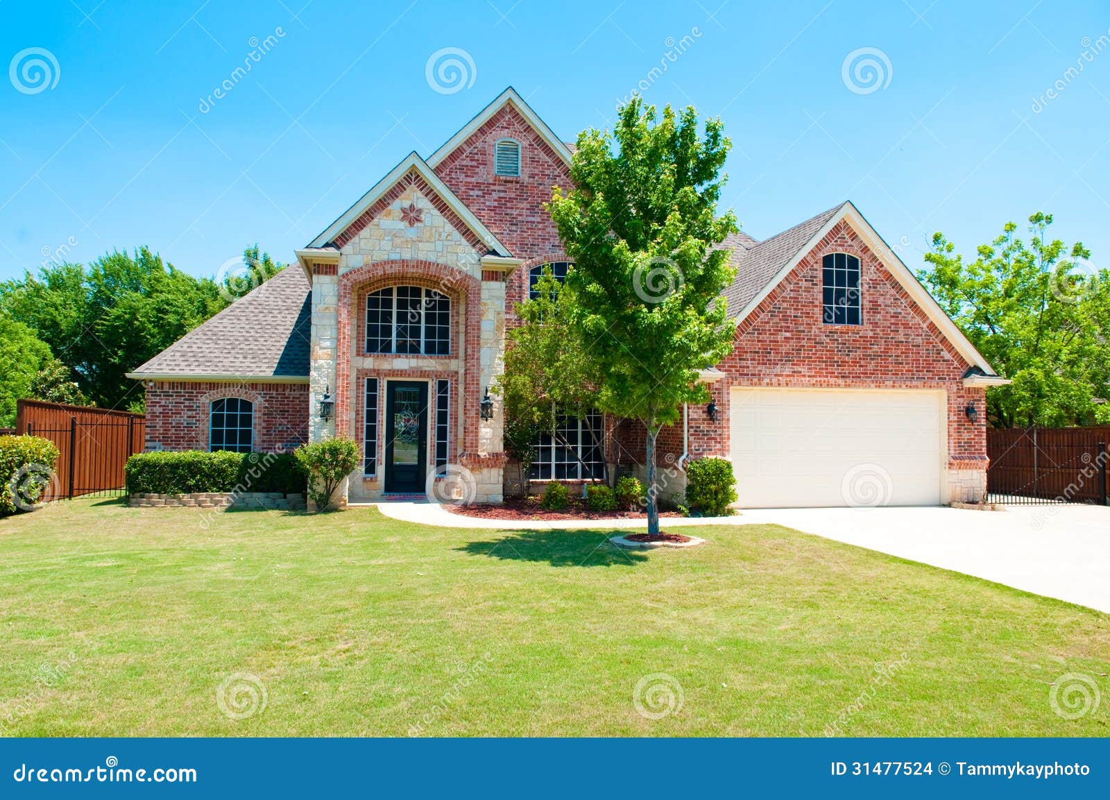 Two Story Brick Home with the Garage in the Front. Stock Photo - Image ...