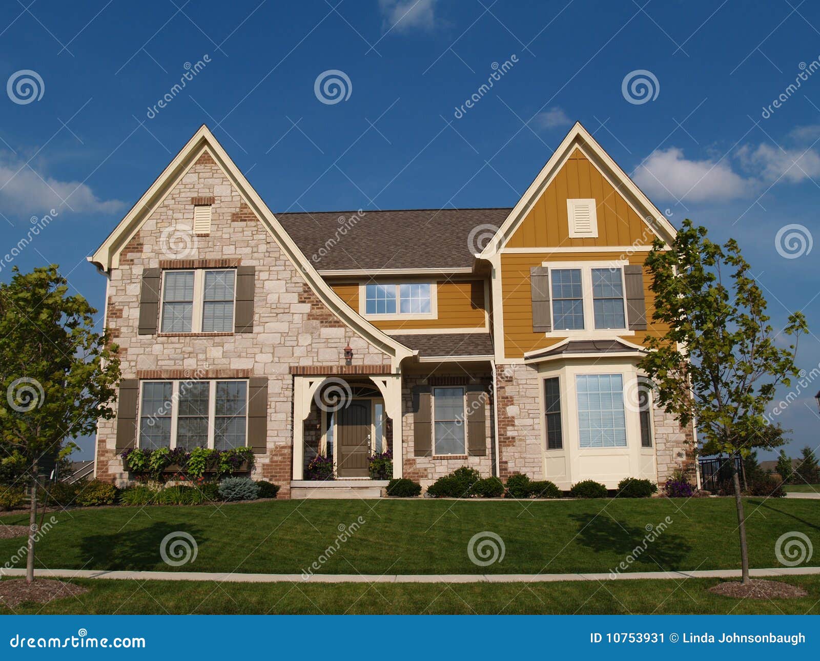 Two Story Stone, Brick and Board Sided Home. Stock Image - Image of ...