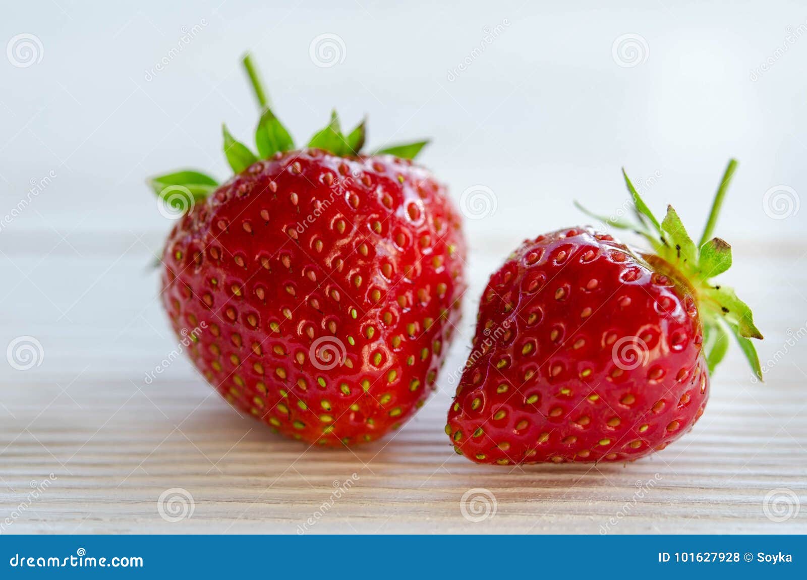 Two Strawberries on Wooden Table Stock Photo - Image of path, shot ...