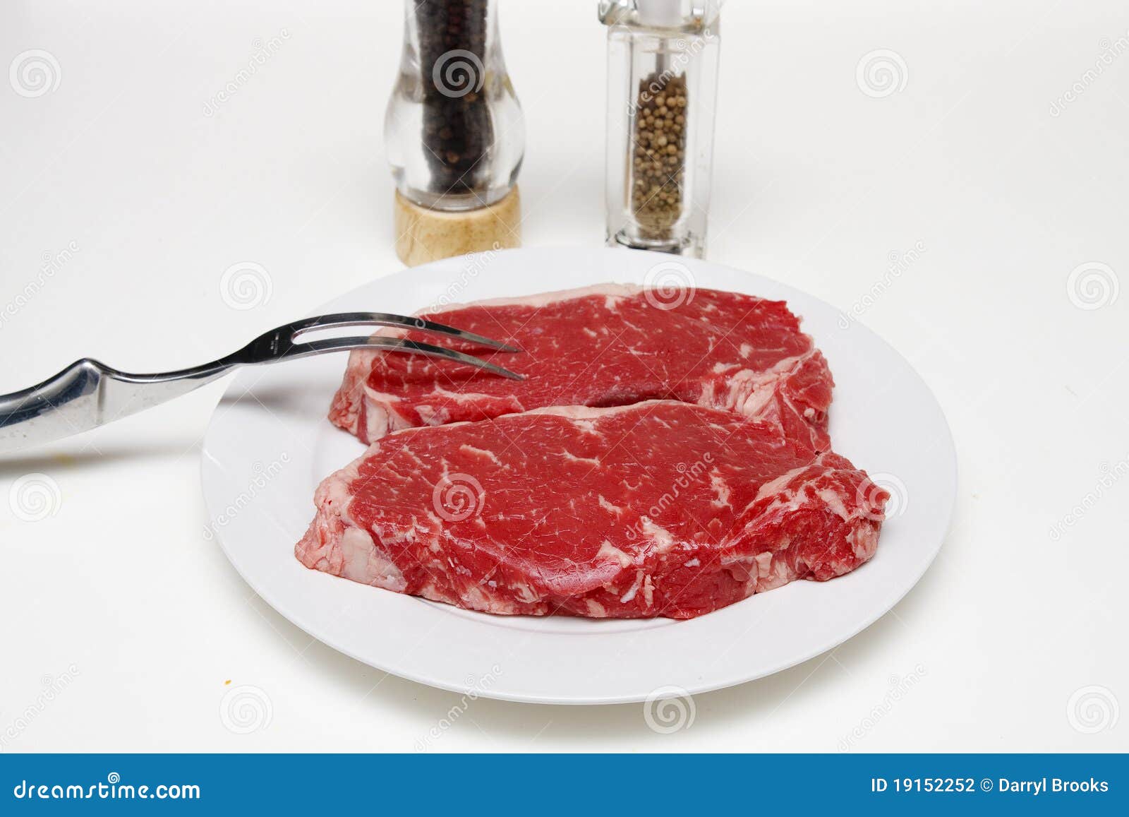 Two Strip Steaks on Plate stock photo. Image of protein - 19152252