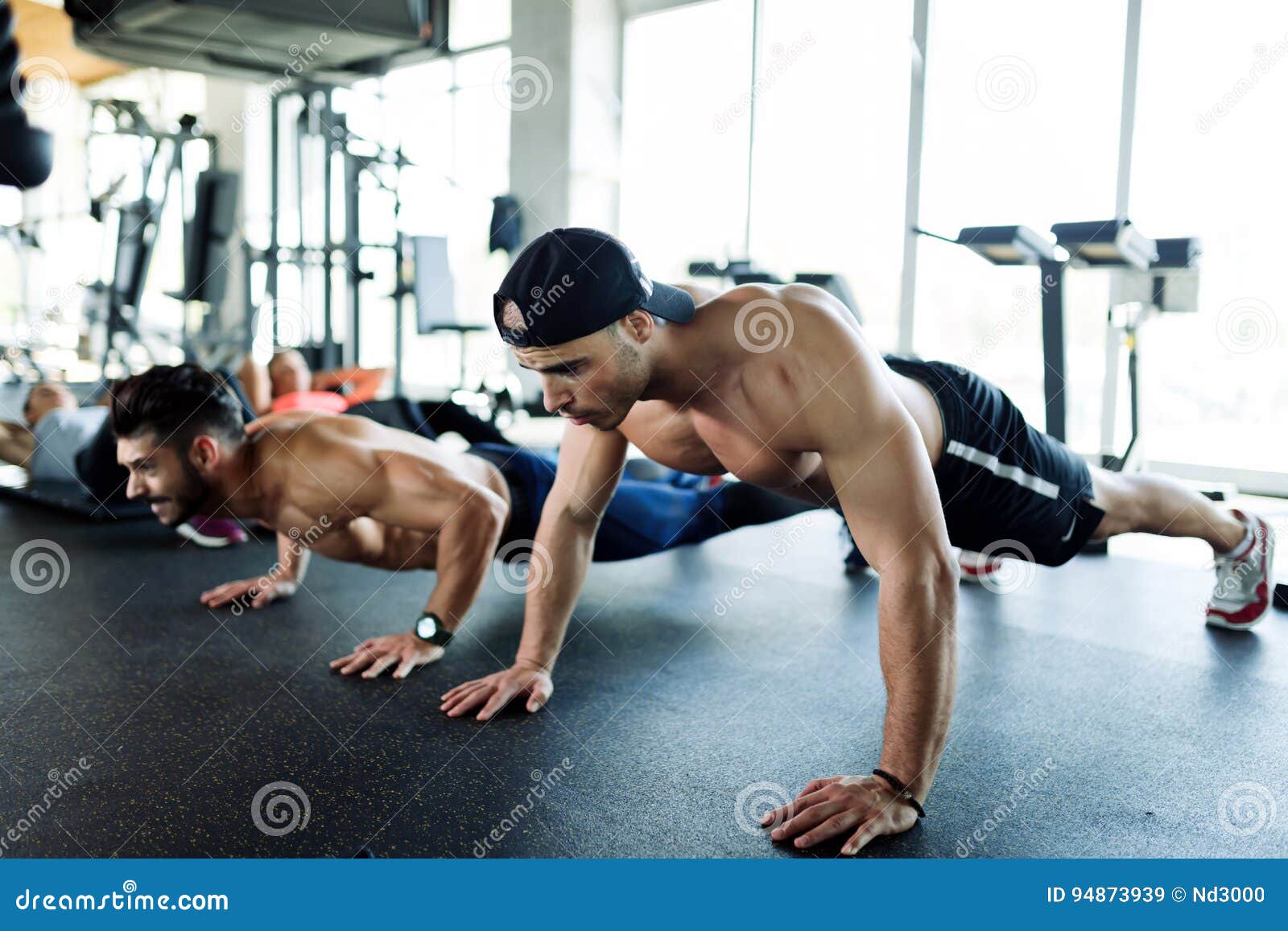 Two Strong Men Doing Push-ups in Gym Stock Image - Image of instructor, active: 94873939