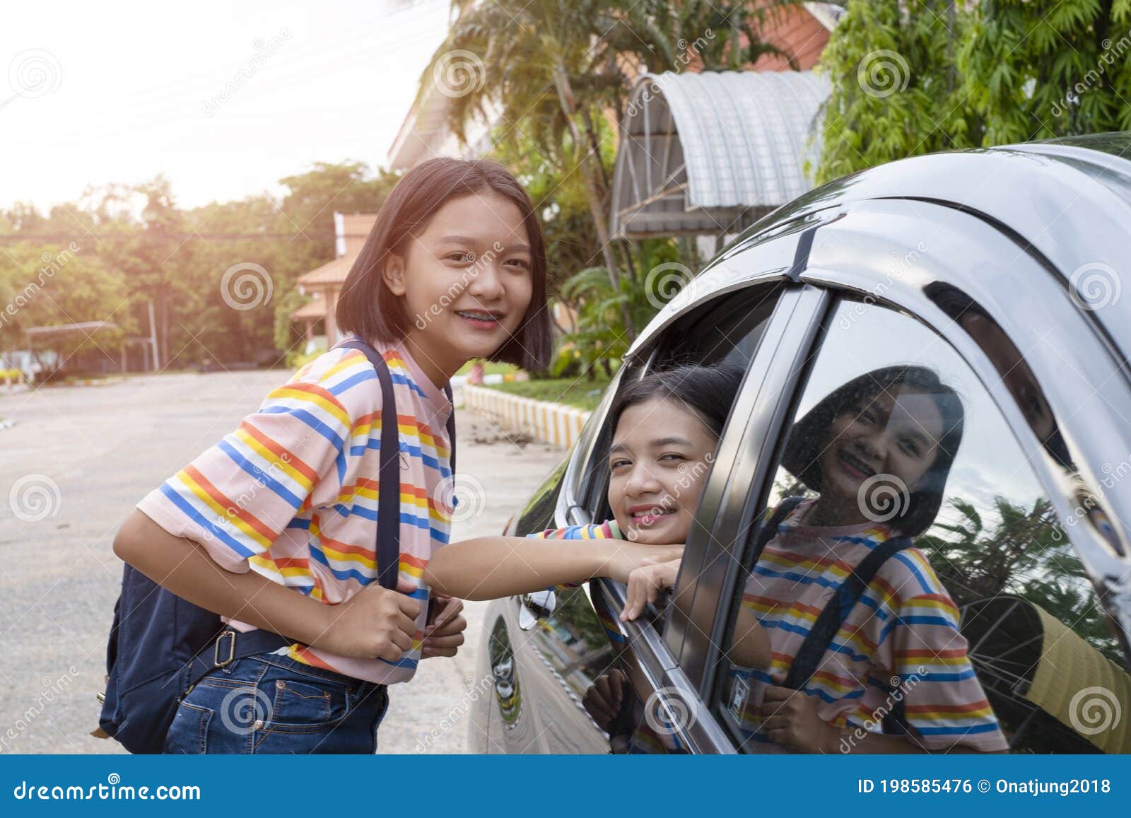 Two Student Girl with Black Car at School Stock Photo - Image of joyful ...