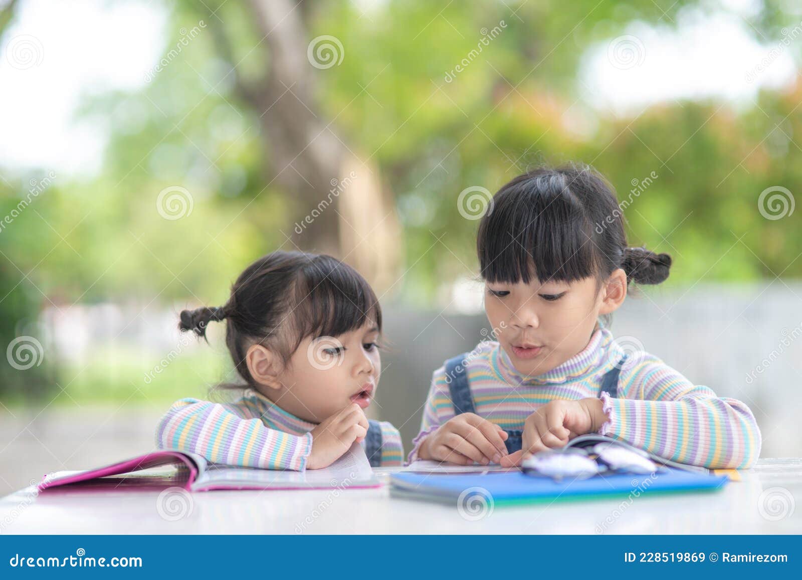Two Student Little Asian Girls Reading the Book on Table Stock Image ...